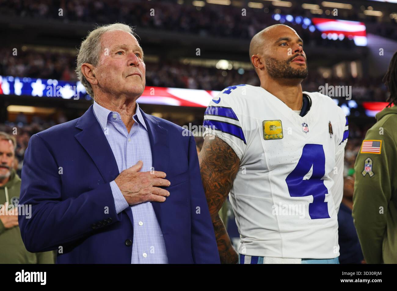 Former president George W. Bush, left, and Dallas Cowboys' Dak Prescott ...