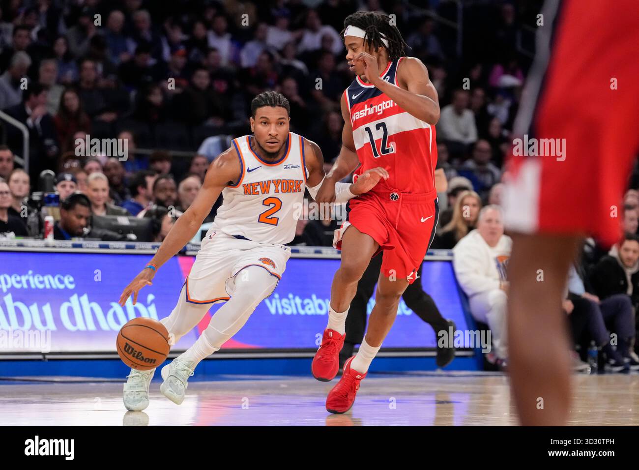 New York Knicks guard Miles McBride (2) drives past Washington Wizards ...