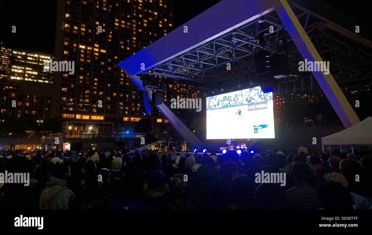 Toronto, ON, Canada - October 31, 2025 - A massive crowd of people ...