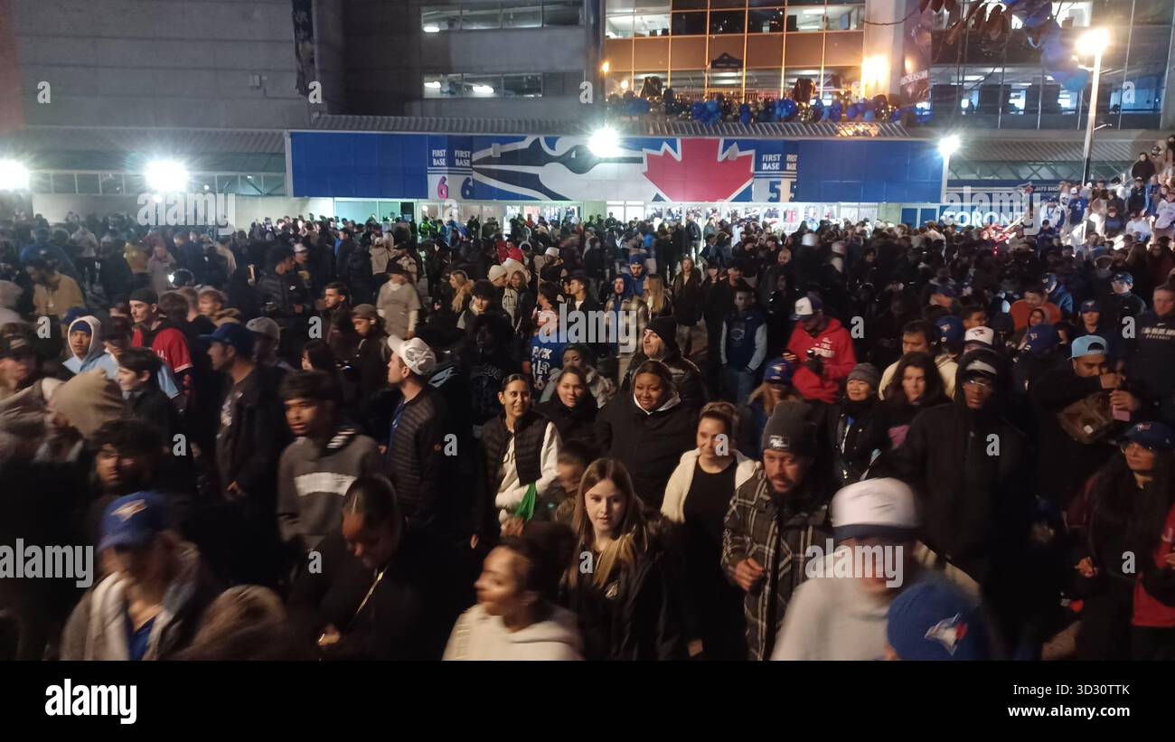 Toronto, ON, Canada - October 31, 2025 - A massive crowd of people ...