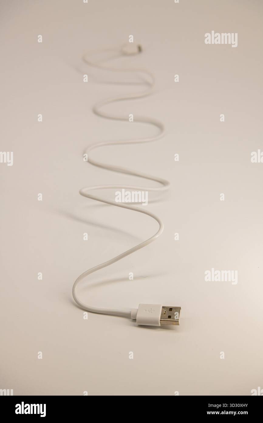 Cable with micro USB and USB connectors on a white background with ...