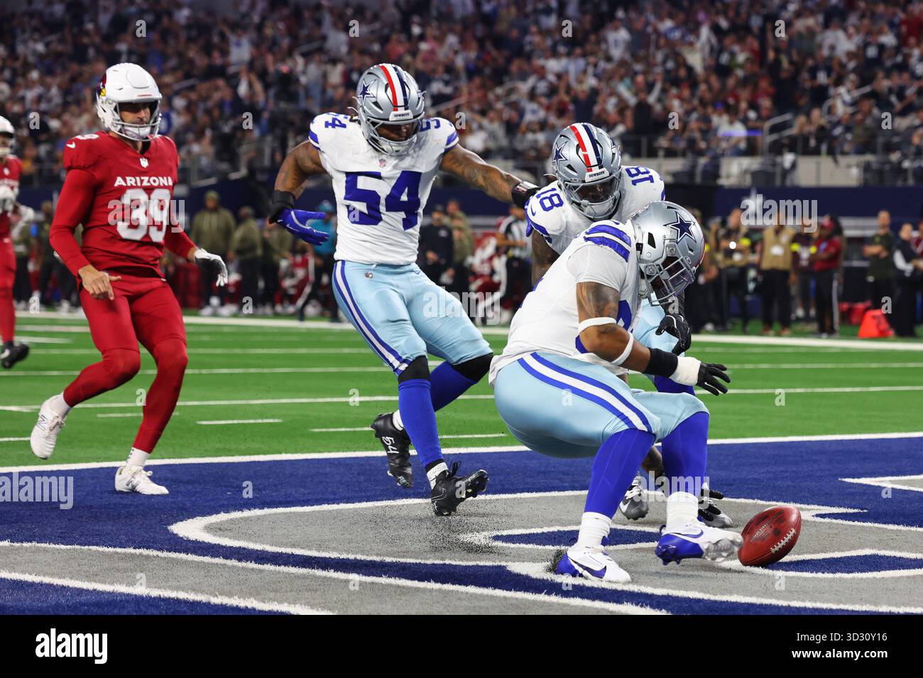 Dallas Cowboys defensive end Marshawn Kneeland, right, recovers a ...