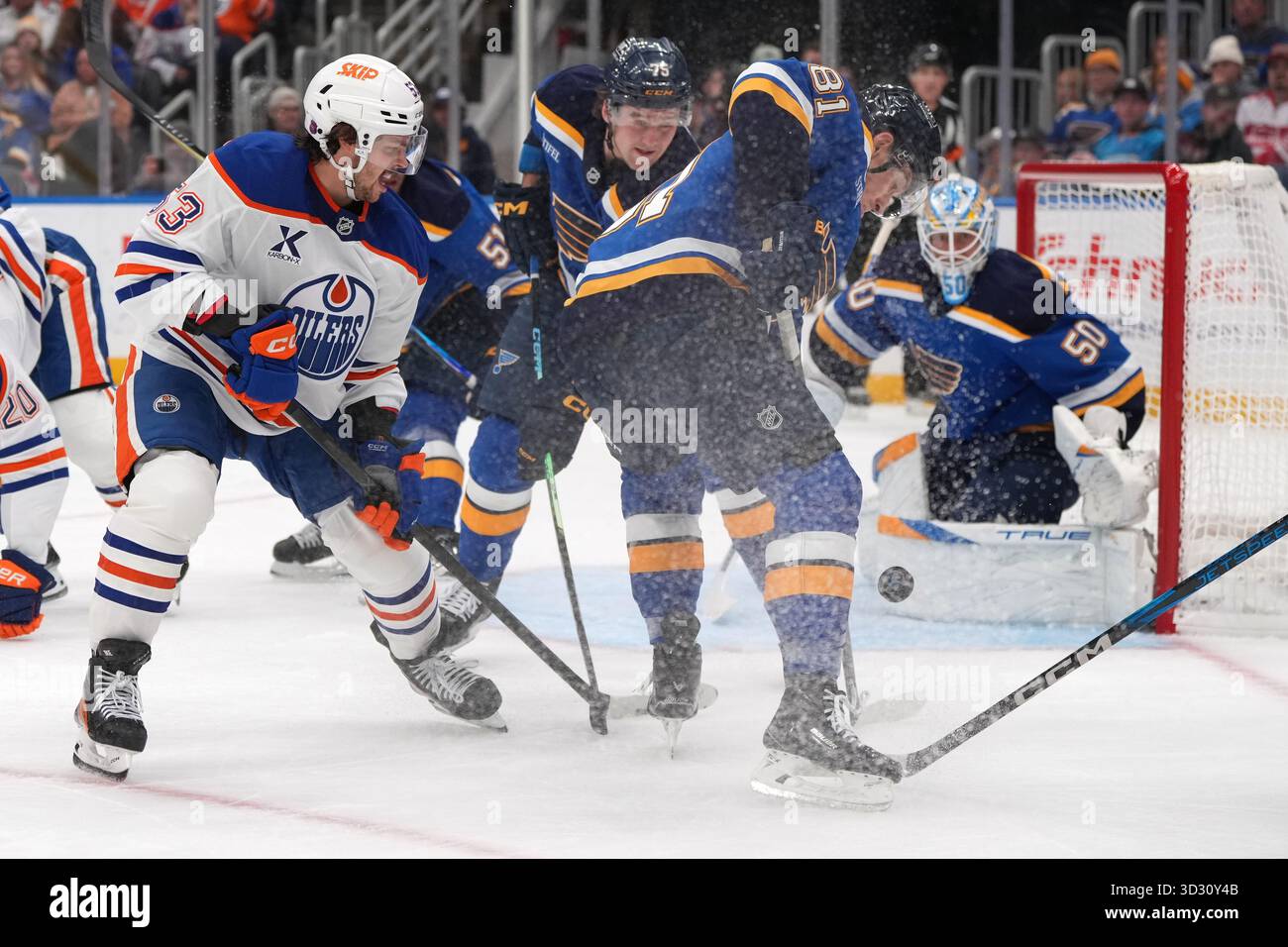 Edmonton Oilers' Isaac Howard, left, and St. Louis Blues' Dylan ...