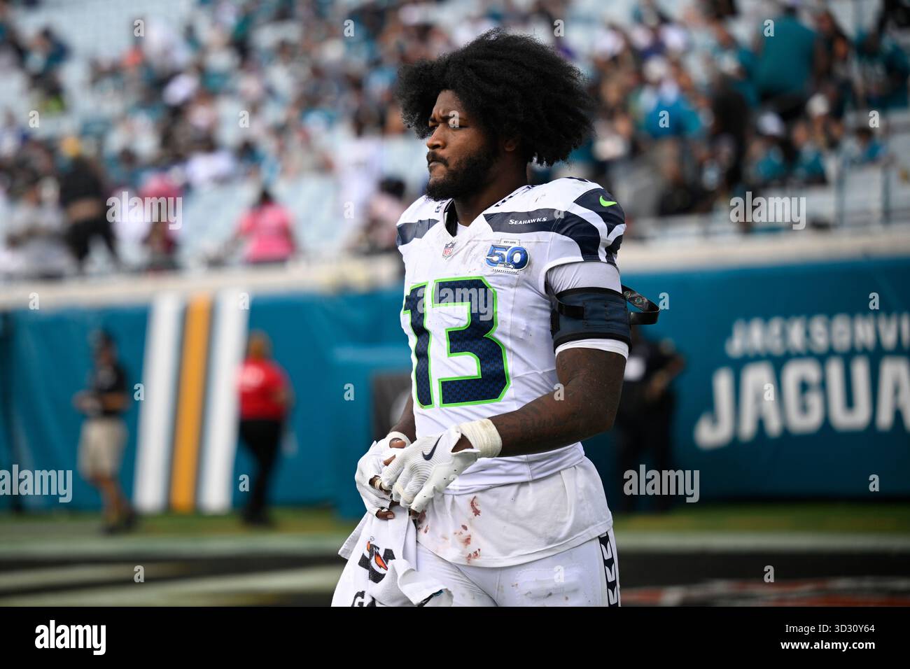 Seattle Seahawks linebacker Ernest Jones (13) heads to the sideline ...