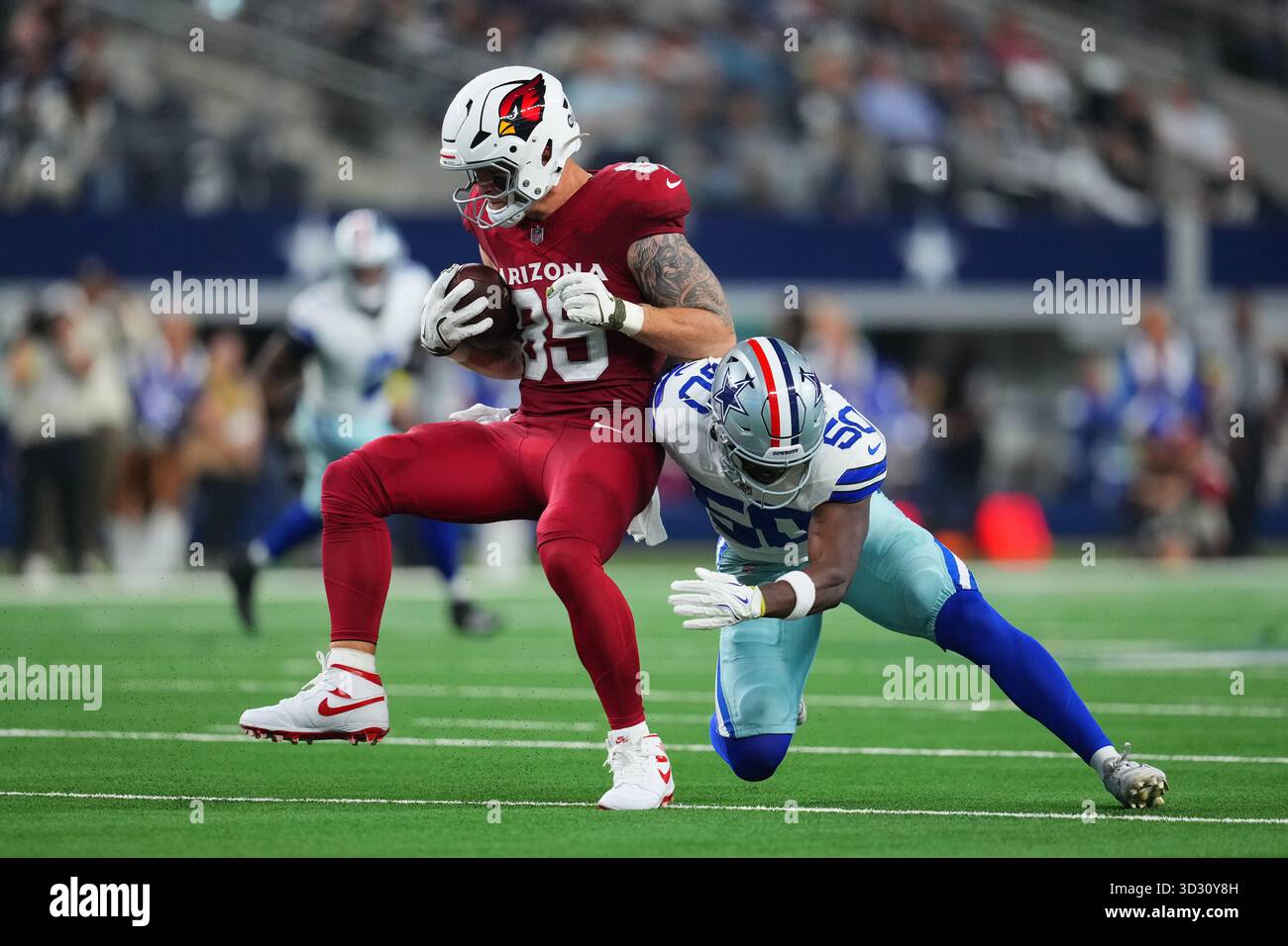 Arizona Cardinals tight end Trey McBride catches a pass as Dallas ...