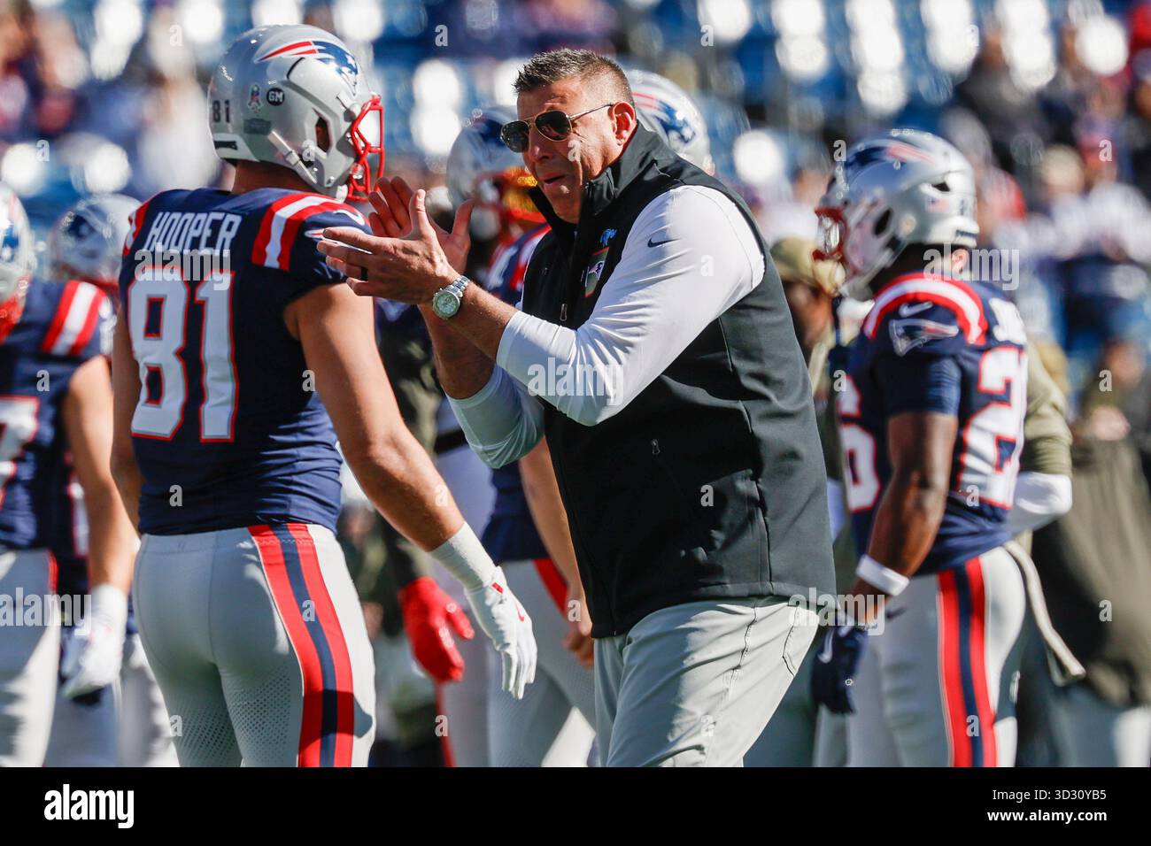 New England Patriots head coach Mike Vrabel cheers on his team prior to ...
