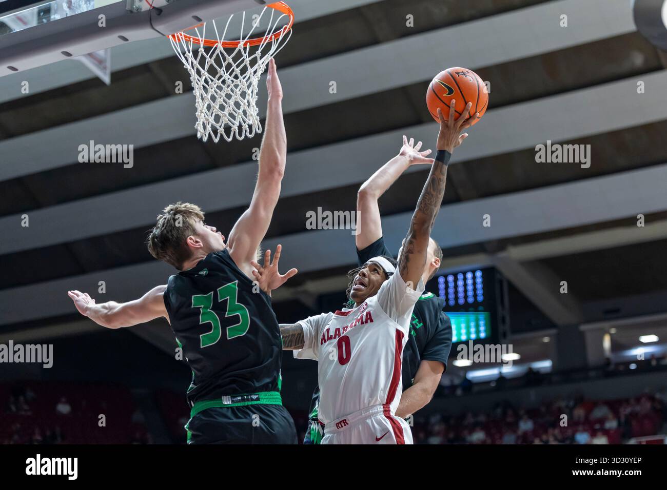 Alabama guard Labaron Philon Jr. (0) ties to shoot against North Dakota ...
