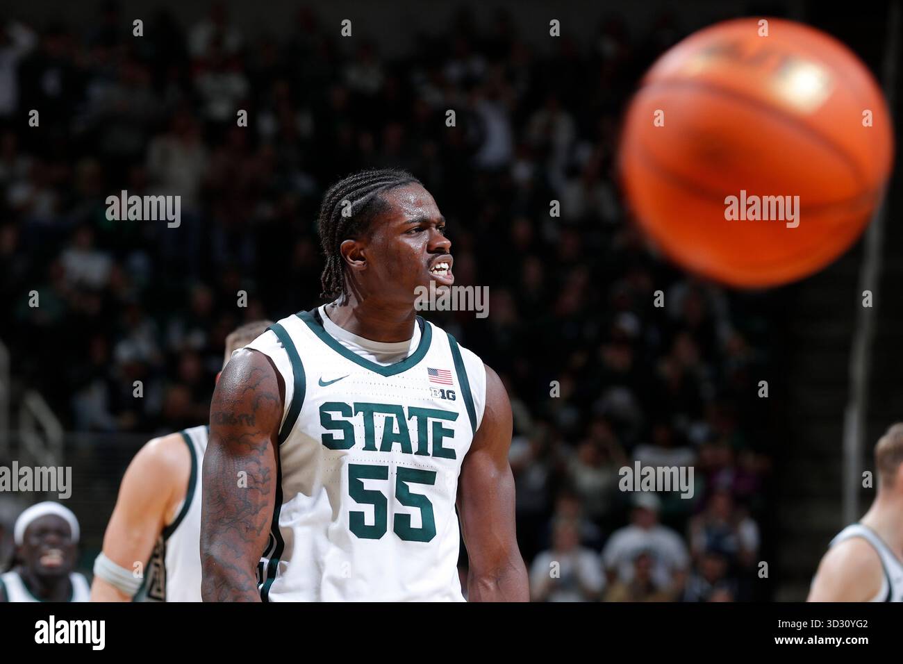 Michigan State forward Coen Carr (55) celebrates after dunking against ...