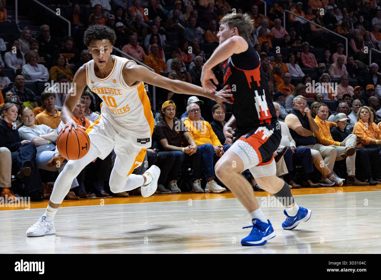 Tennessee forward Nate Ament (10) drives against Mercer guard Brady ...