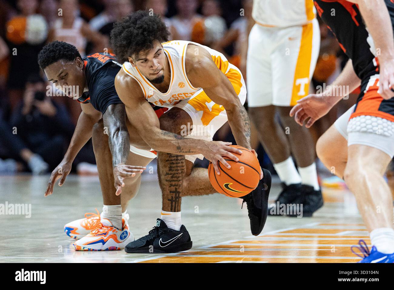 Mercer guard Quinton Perkins II, left, tries to steal the ball from ...