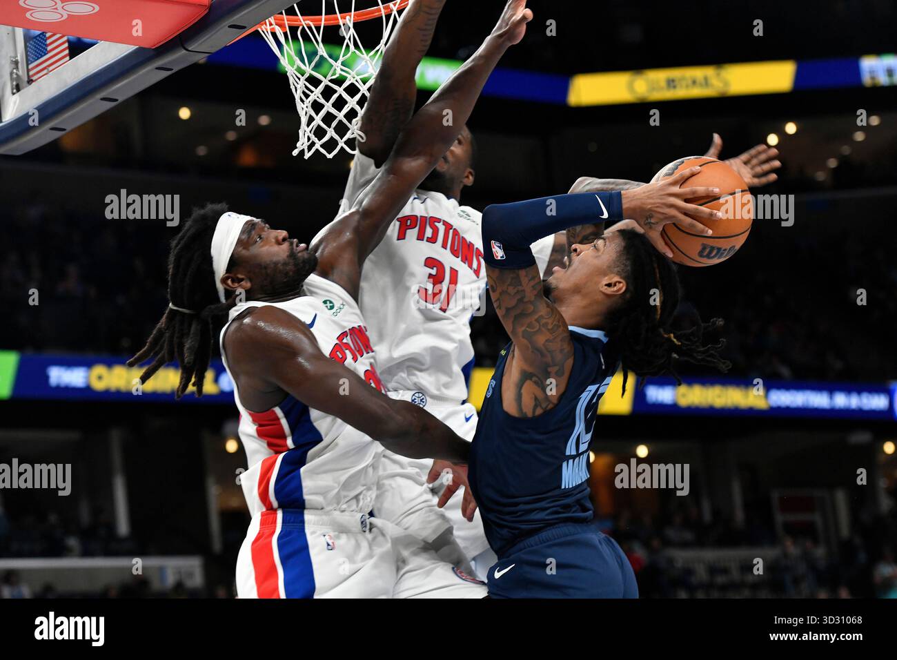 Memphis Grizzlies guard Ja Morant, right, shoots against Detroit ...