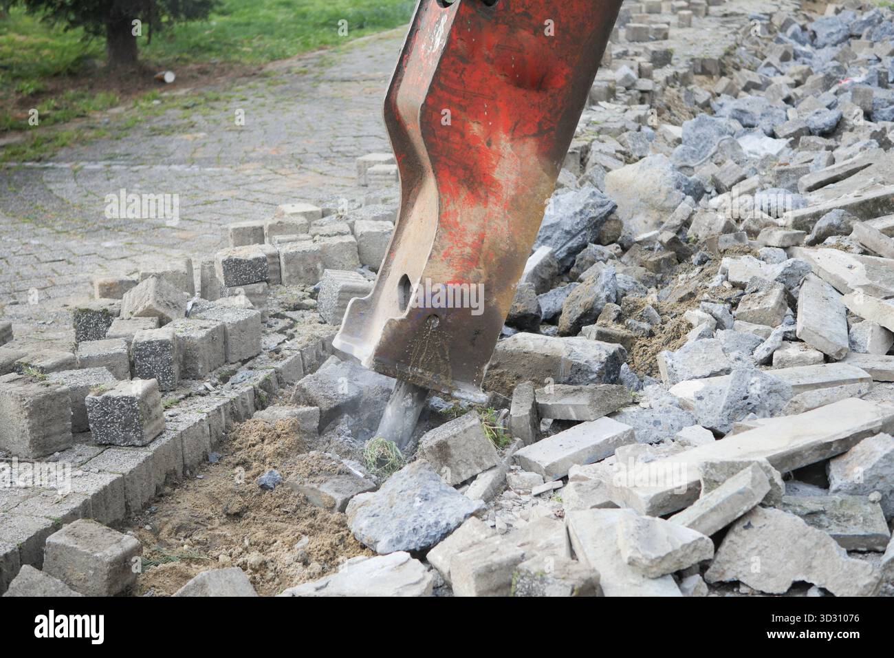 Heavy machinery breaking ground in urban construction site Stock Photo ...