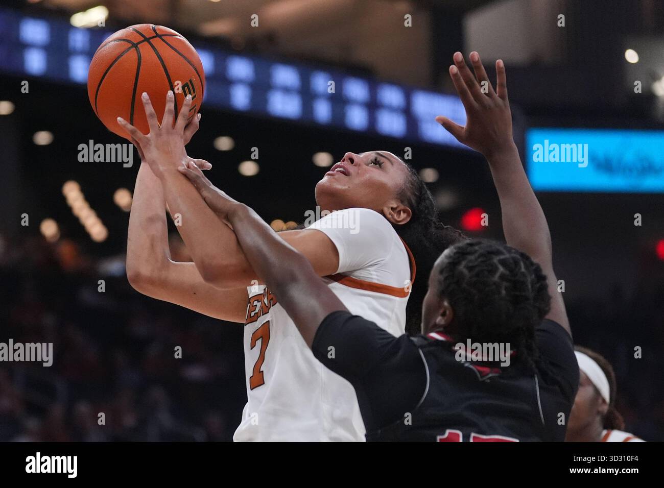 Texas guard Jordan Lee (7) is fouled by Incarnate Word guard Madison ...