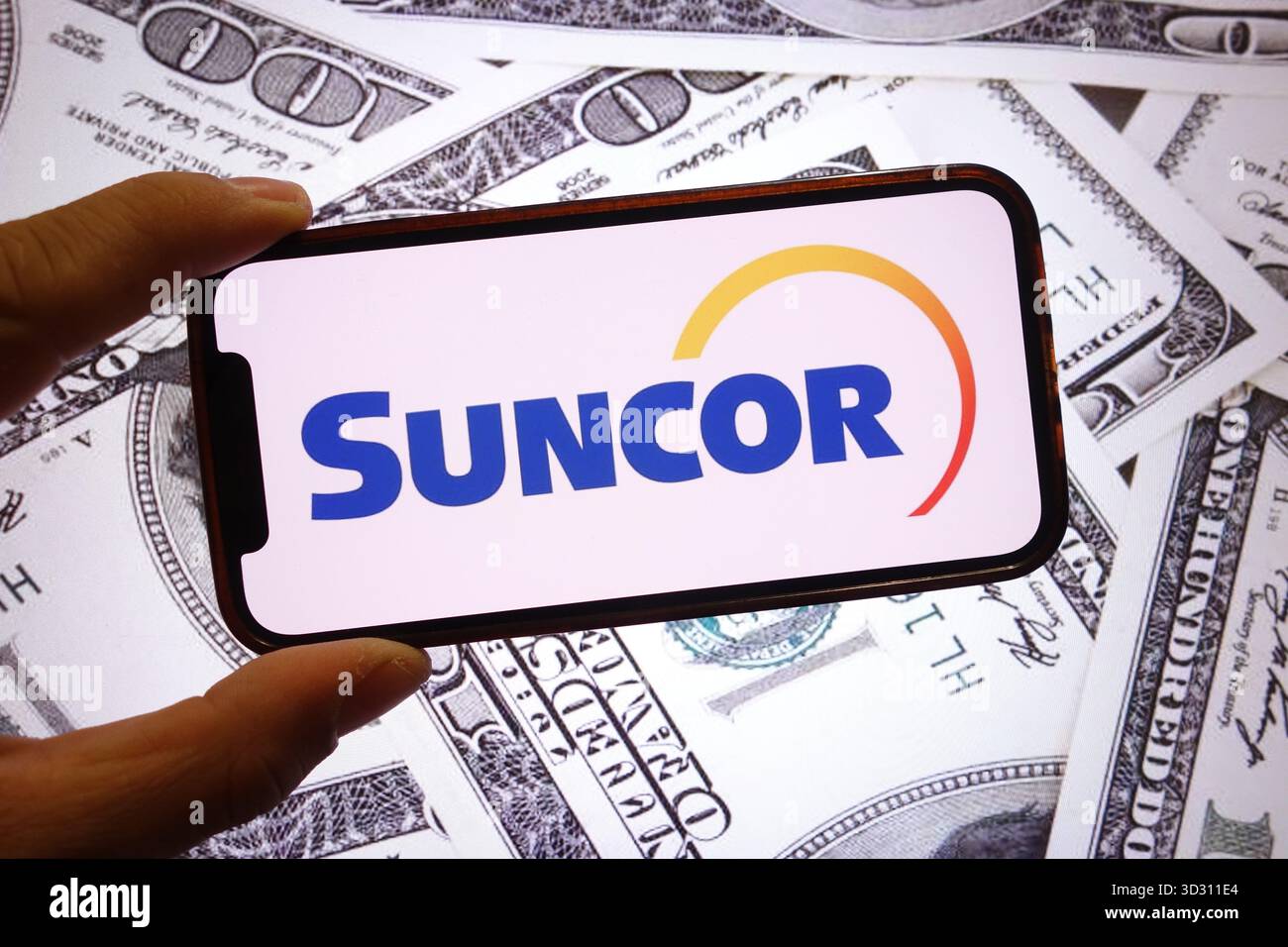 In this photo illustration, the Suncor Energy company logo is seen ...