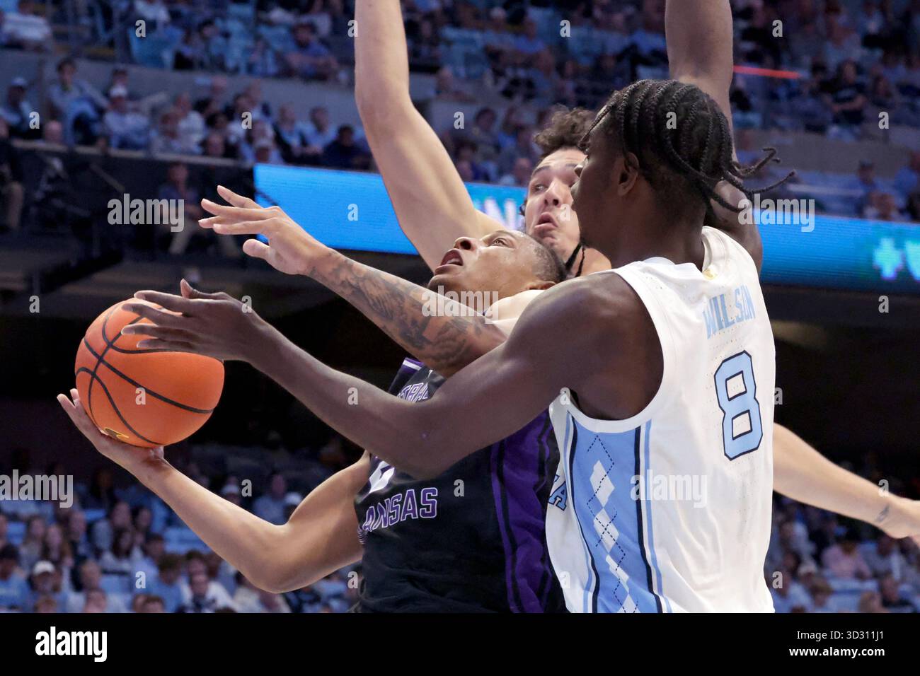 Central Arkansas guard Javion Guy-King, left, is defended by North ...