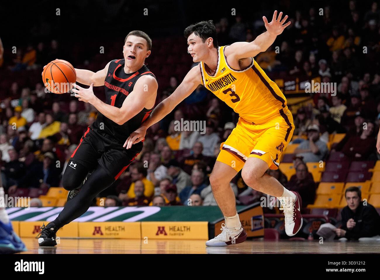 Gardner Webb guard Spence Sims (1) works toward the basket as Minnesota ...