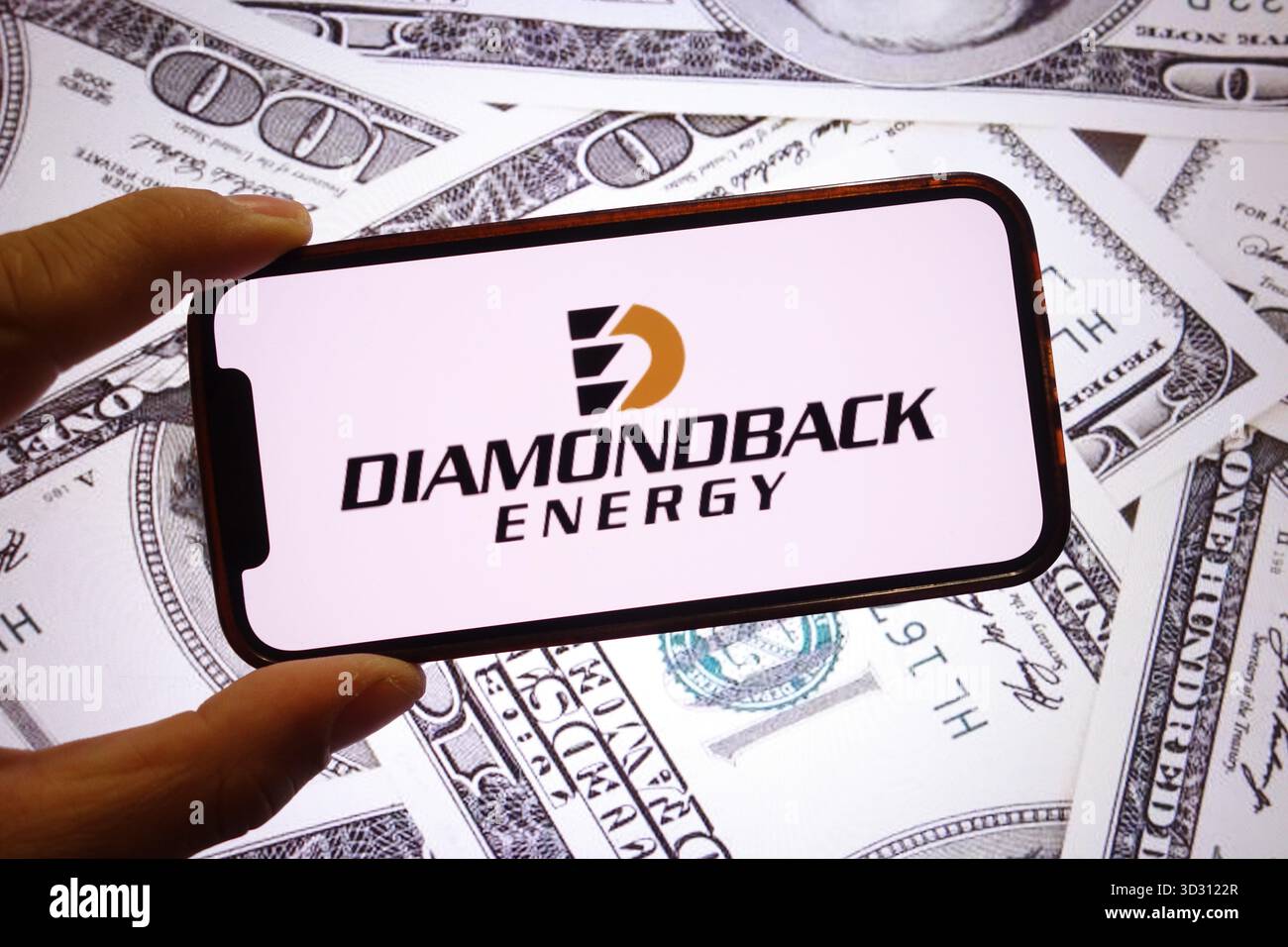 In this photo illustration, the Diamondback Energy company logo is seen ...