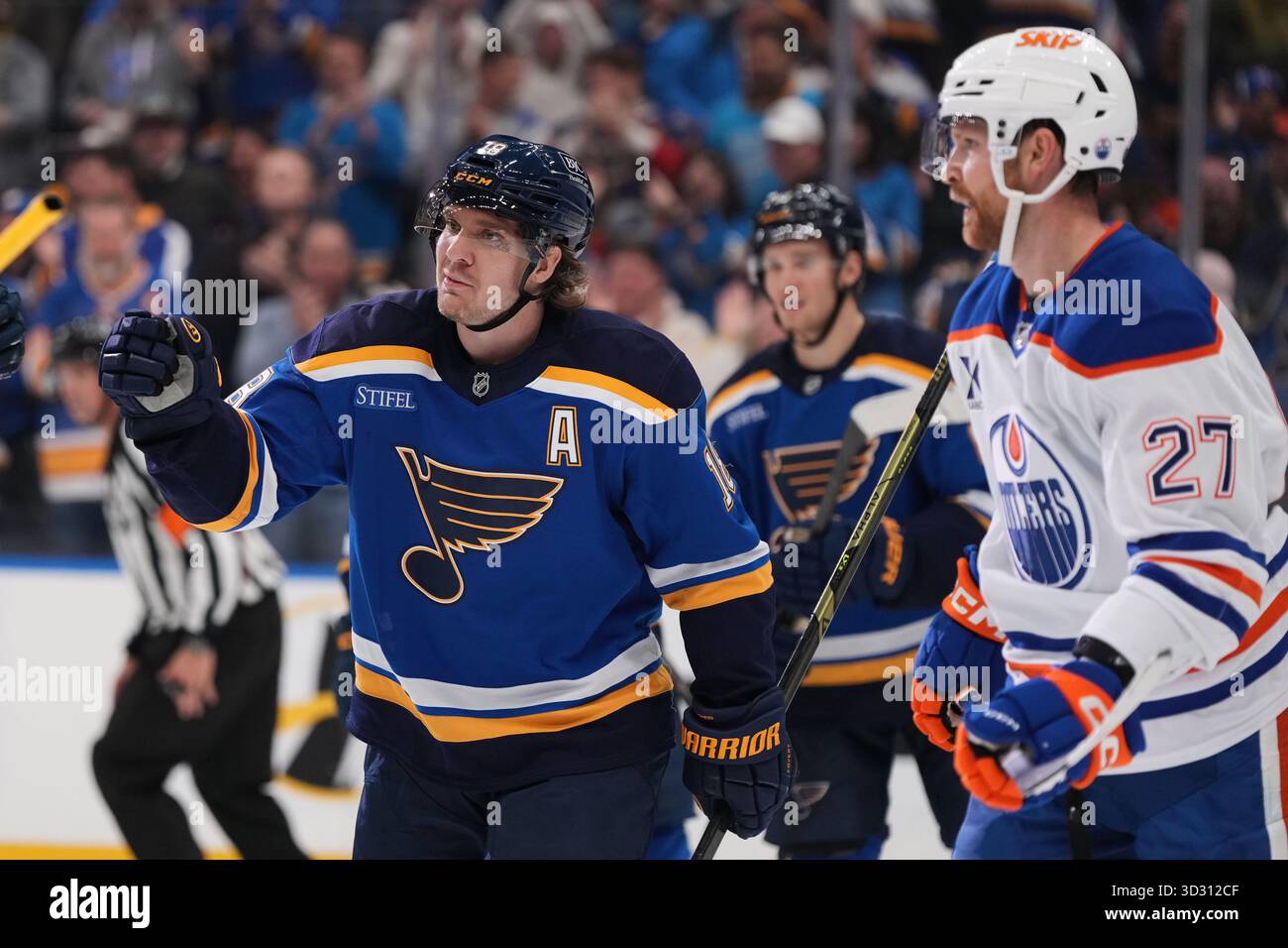 St. Louis Blues' Robert Thomas, left, skates past Edmonton Oilers ...