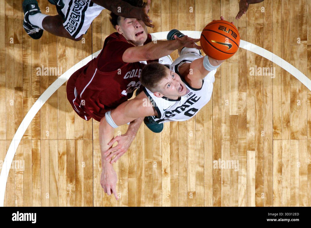 Michigan State forward Jaxon Kohler (0), right, and Colgate forward Sam ...