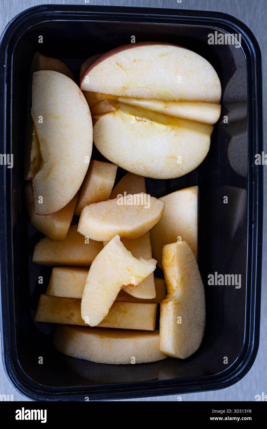 Freshly Peeled Apple Slices In Plastic Box, A crisp ad photo of freshly ...