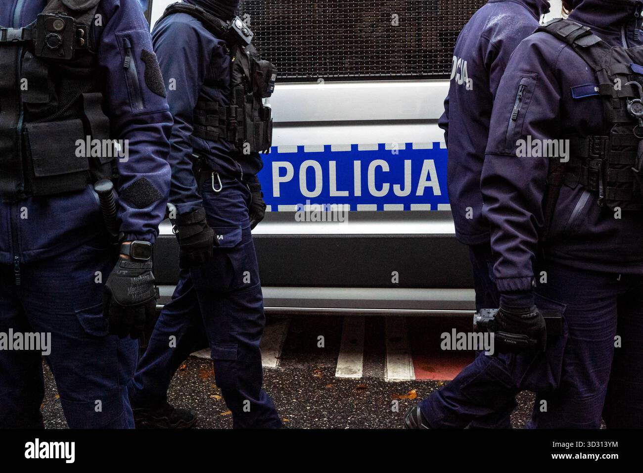 Polish police officers maintain order at a protest. A collection of ...