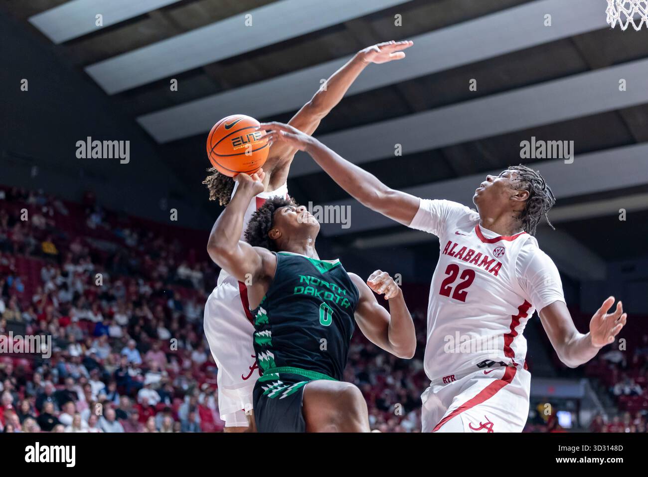 Alabama forward Aiden Sherrell (22) blocks a shot by North Dakota forward Marley Curtis (0 ...