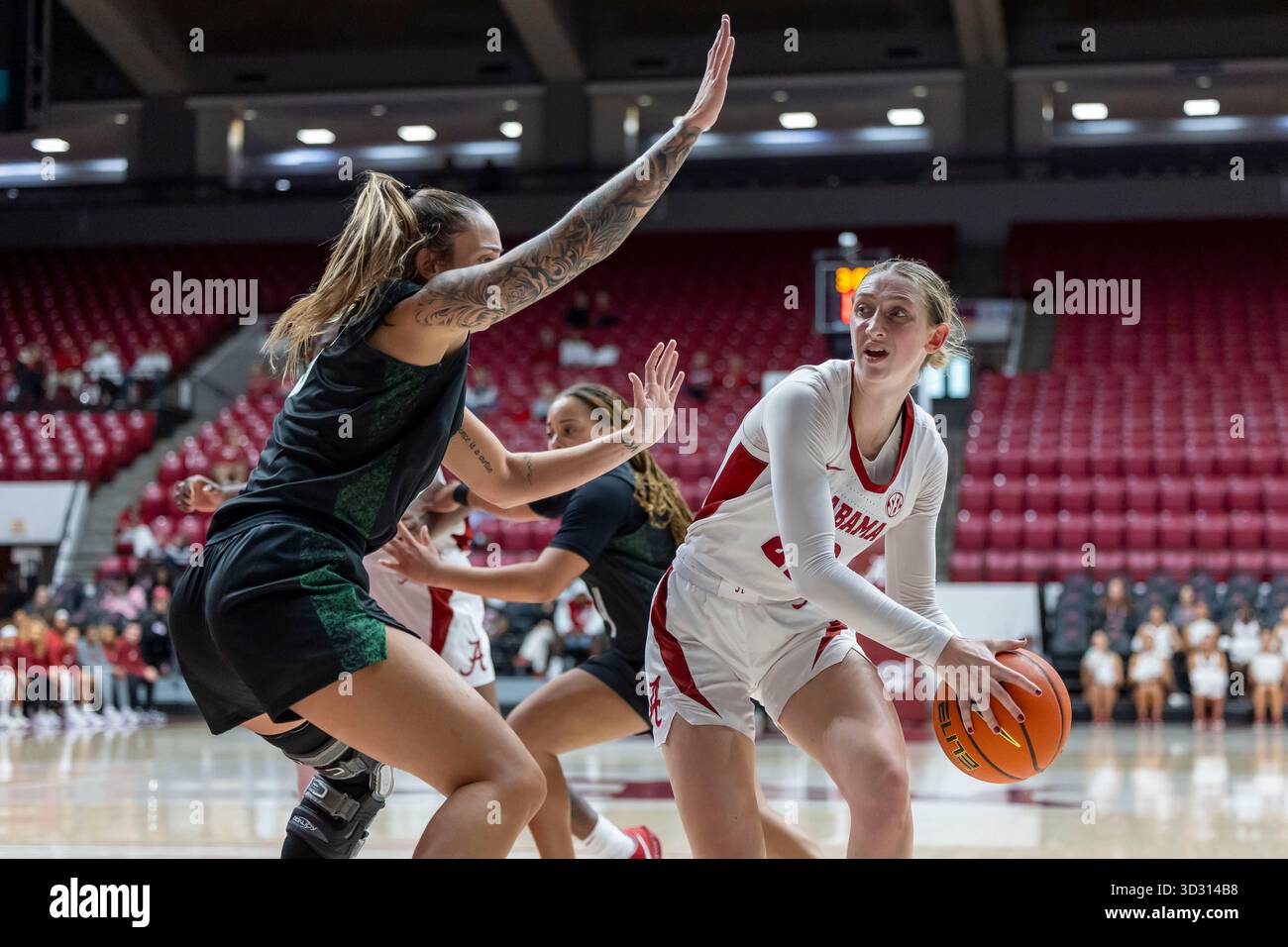 Alabama guard Karly Weathers (22) works against Stetson forward Aleah ...