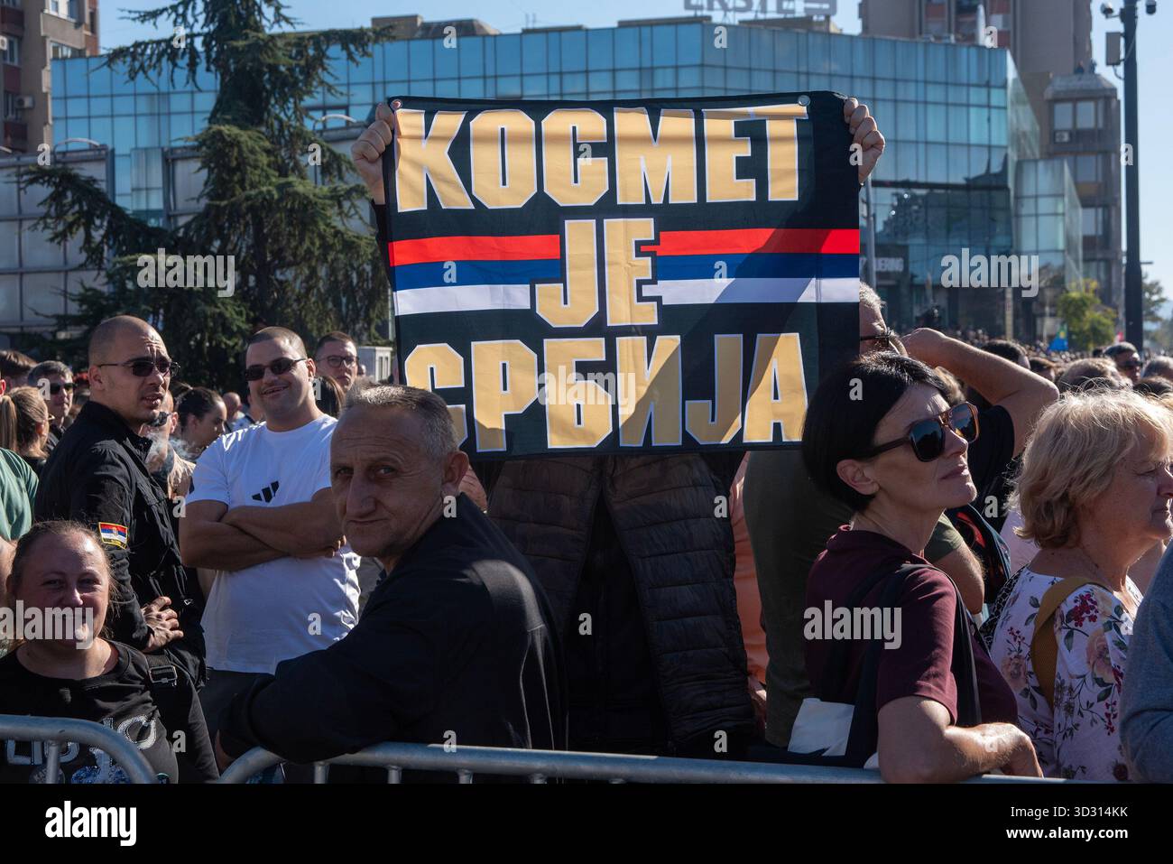 A mourner holds a banner before the commemoration ceremony outside the ...