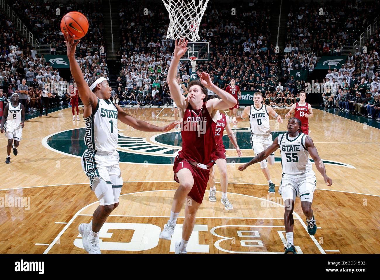 Michigan State guard Jeremy Fears Jr. (1), left, passes the ball ...