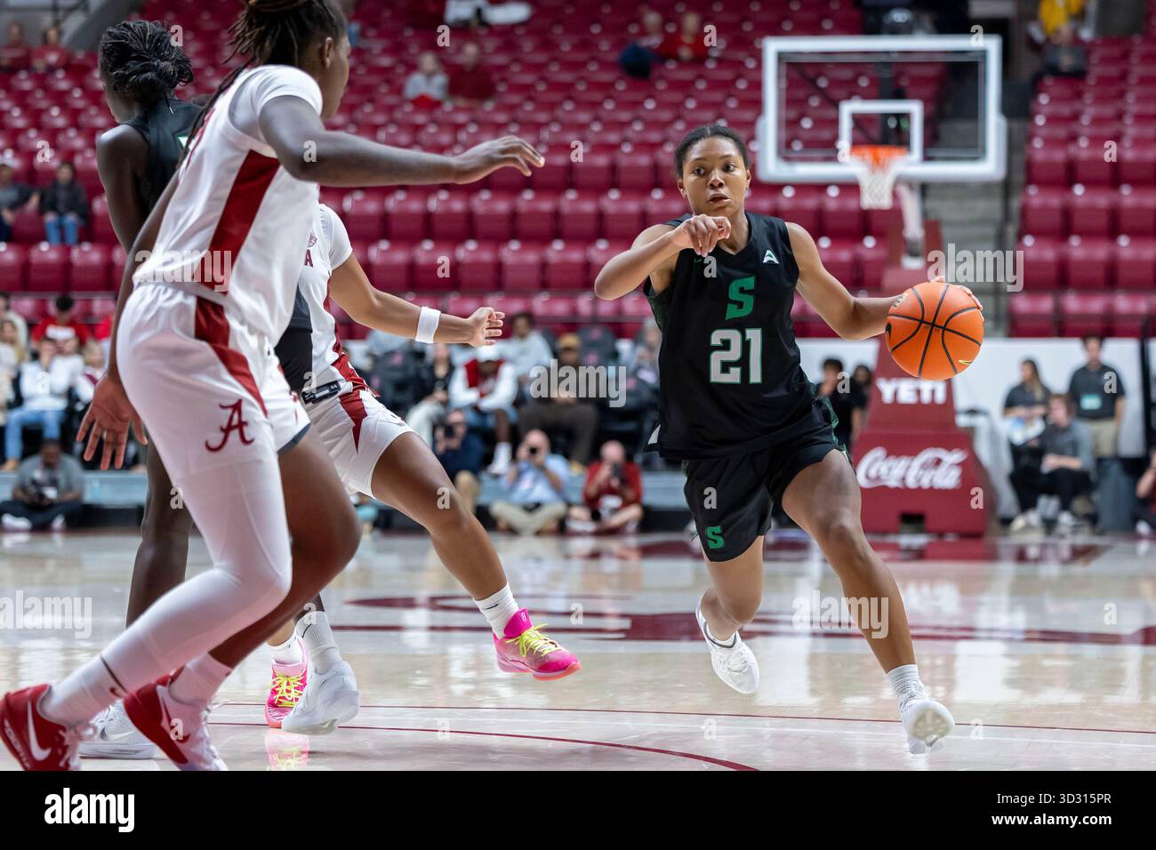 Stetson guard Cameron Thomas (21) works inside against Alabama during ...