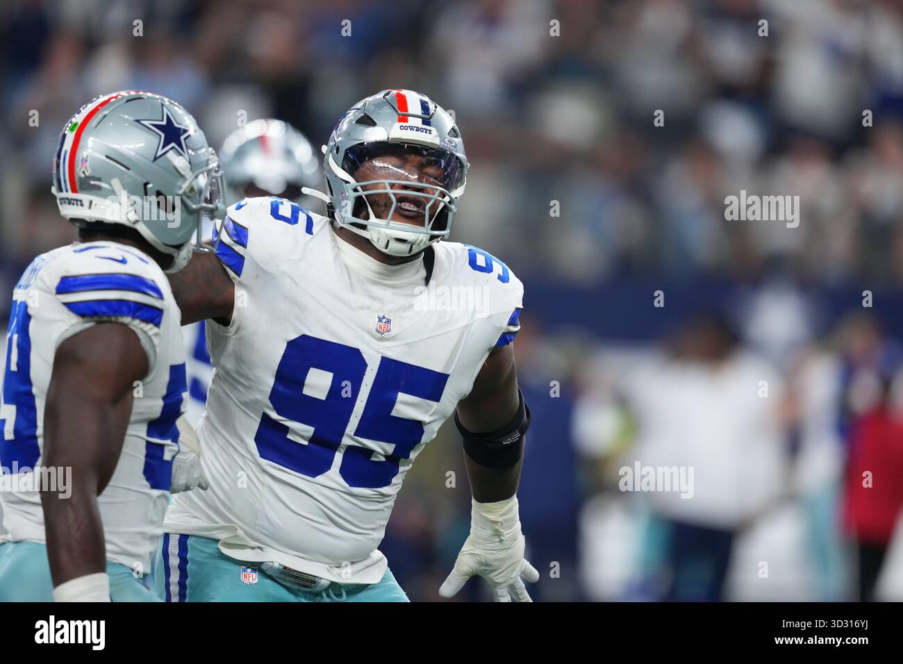 Dallas Cowboys defensive tackle Kenny Clark (95) reacts to making a ...