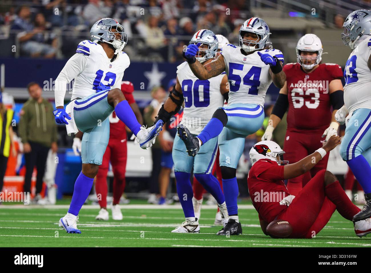 Dallas Cowboys' Dante Fowler Jr. (13) and Sam Williams (54) celebrate ...