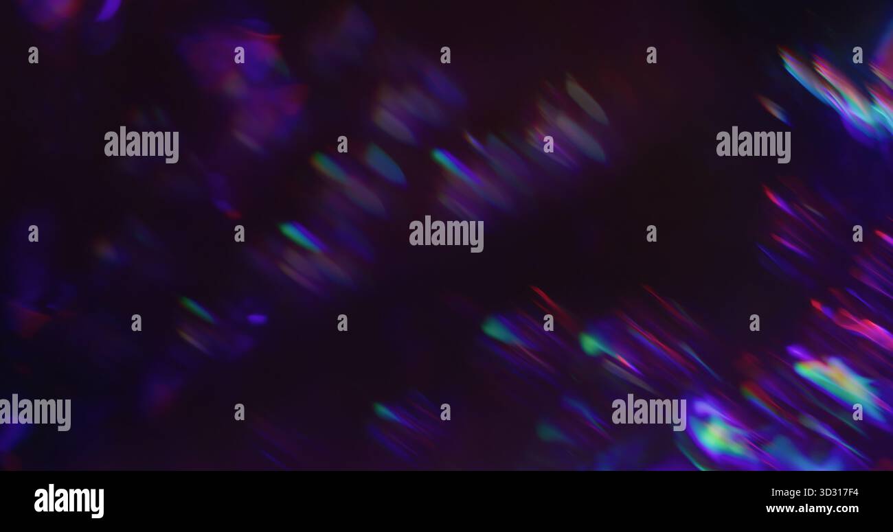Defocused lens prism. Holographic glow leak. Spectrum color twinkle on night background. Purple ...