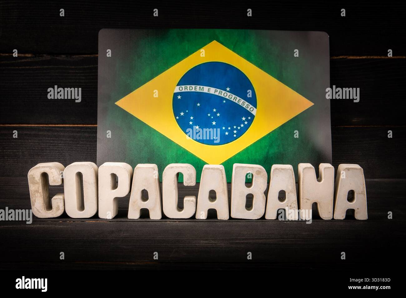 Brazilian flag with bold Copacabana text in front, representing Rio de ...