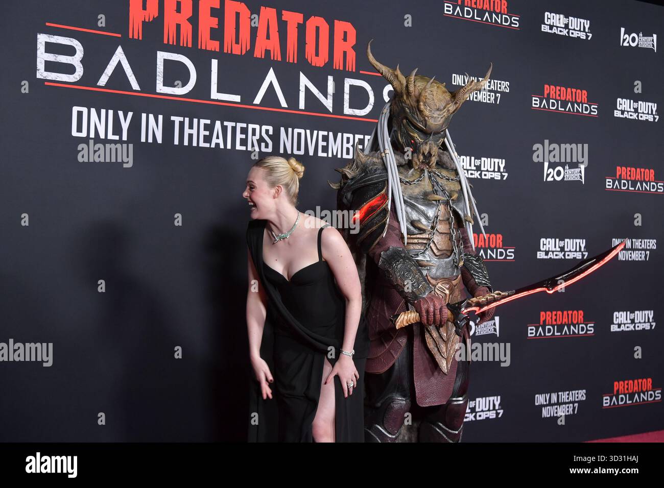 Elle Fanning arrives at the premiere of "Predator: Badlands" on Monday ...