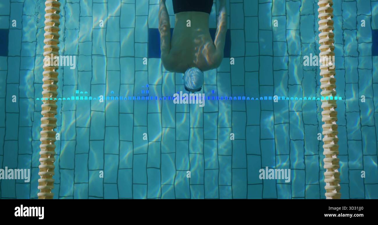 Gliding swimmer wearing swim cap pushing through pool lane, with ...