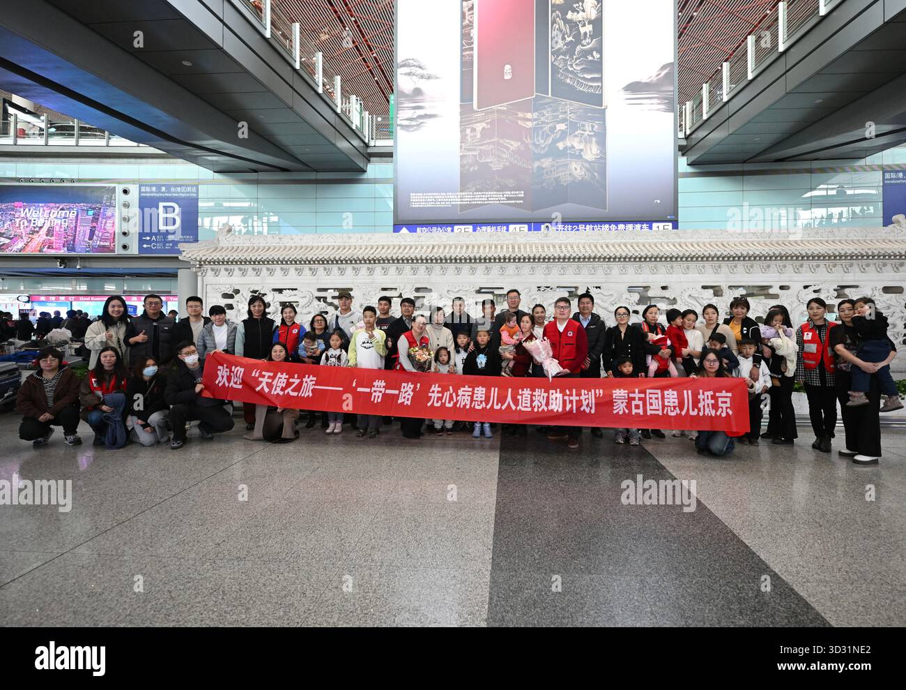 The children posed for a group photo with their parents, staff from the ...