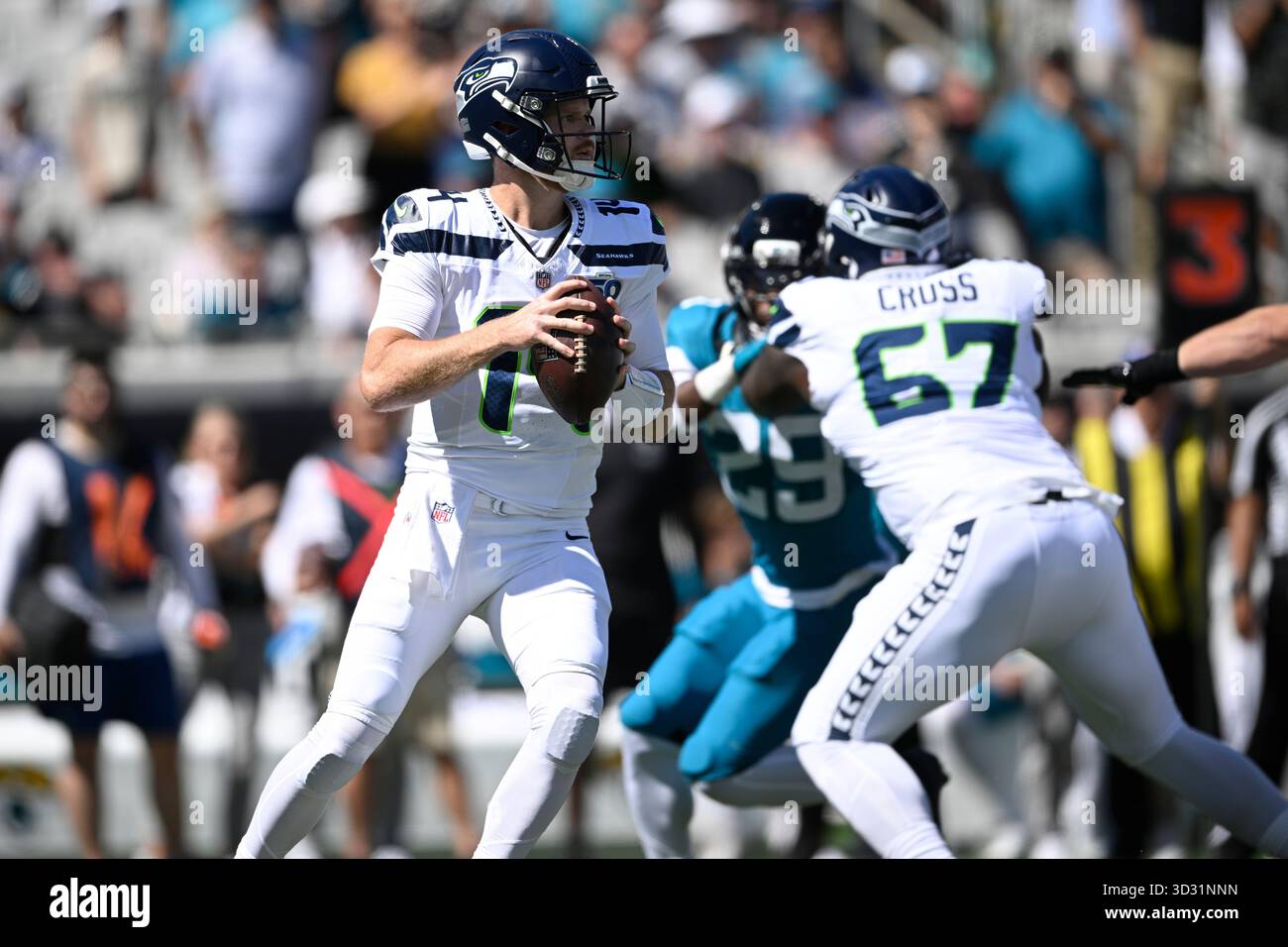 Seattle Seahawks quarterback Sam Darnold (14) looks for a receiver ...