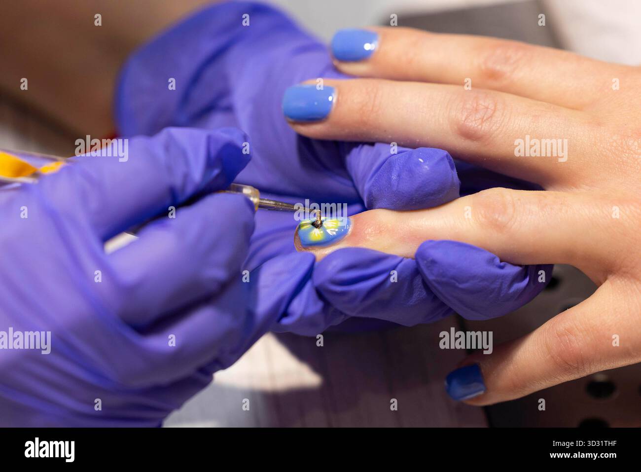 EDITORIAL USE ONLY Former carer Ellen Goodwin receives a manicure at ...
