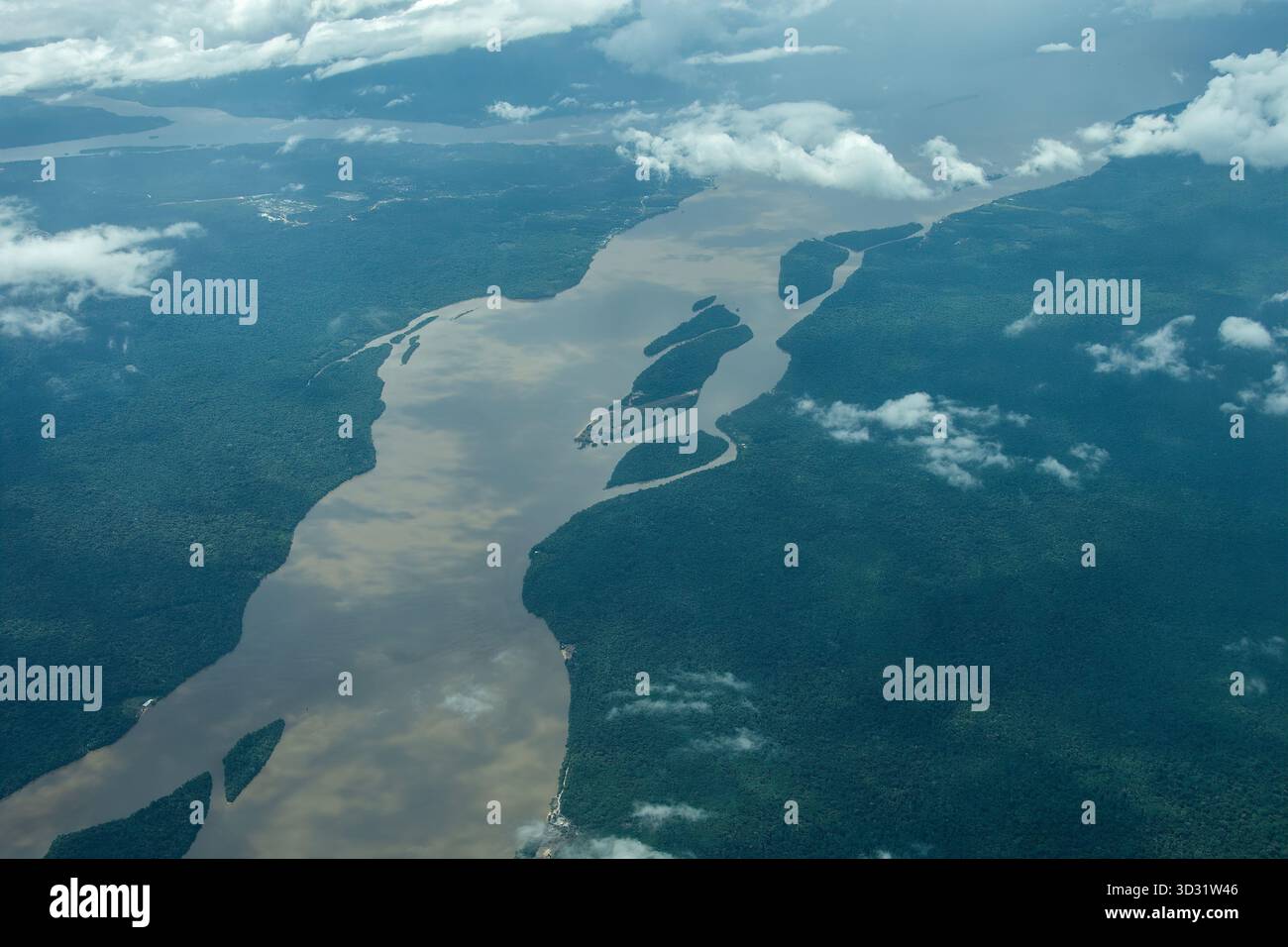 Essequibo River, being joined by the Mazaruni River to the north, just ...
