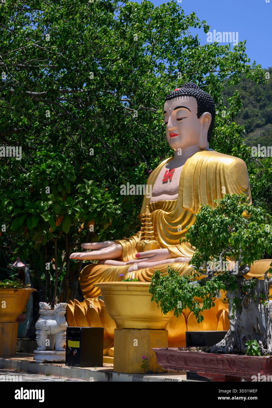NHA TRANG, VIETNAM - APRIL 28, 2025. Gilded sculpture of meditating ...