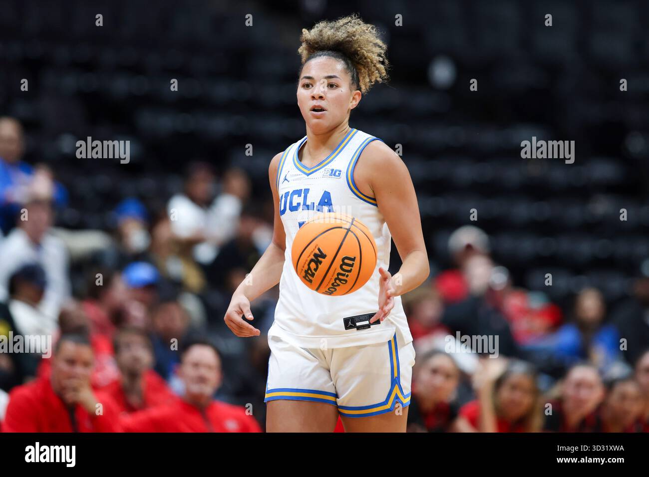 UCLA guard Kiki Rice (1) dribbles down the court during the second half ...