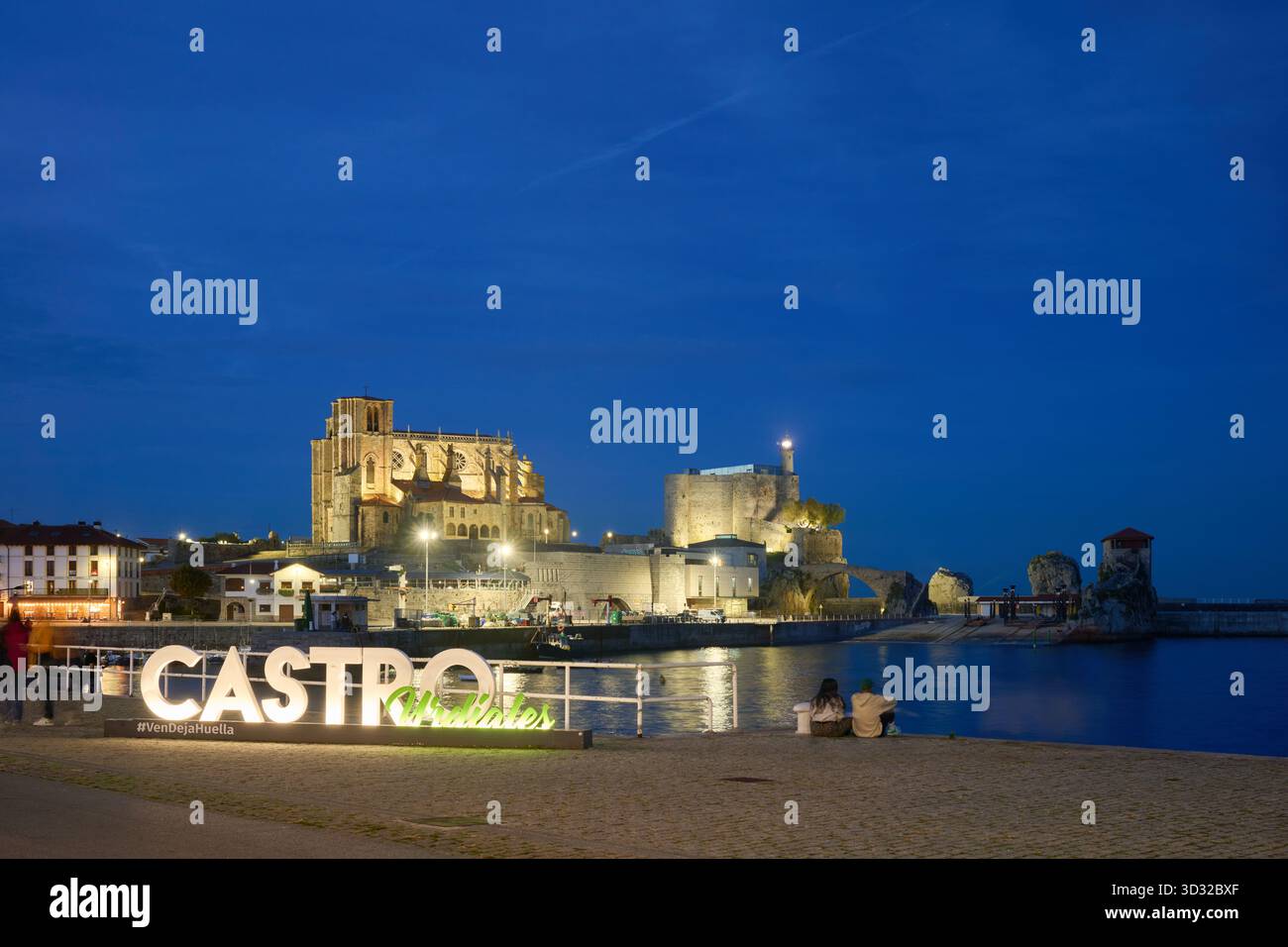 Castro urdiales sign illuminating historic church and harbor town Stock ...