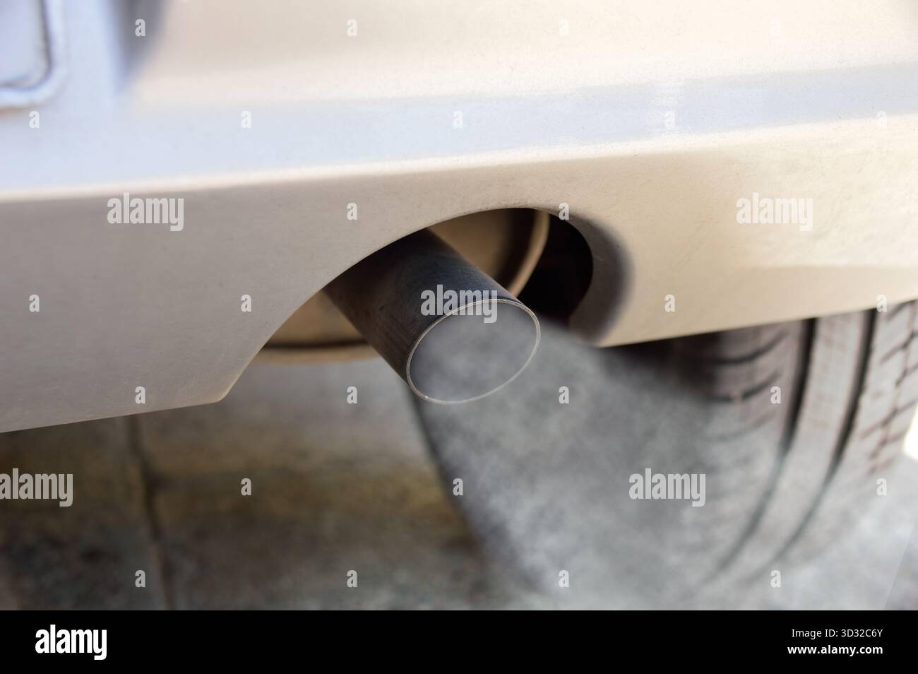 combustion fumes coming out of car exhaust pipe as concept of damage in ...
