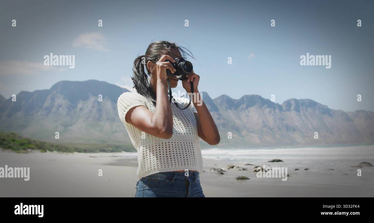 Female photographer raising dslr blue hi-res stock photography and ...