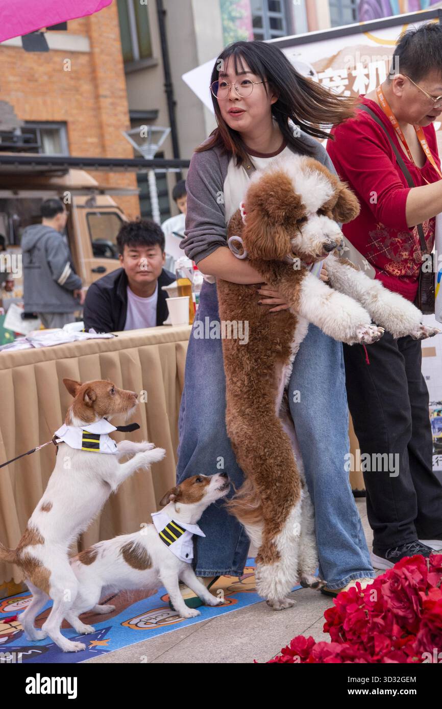 People take their pets to visit the 5th Shanghai Petjoy Fashion Week event in Shanghai, China, 1 ...