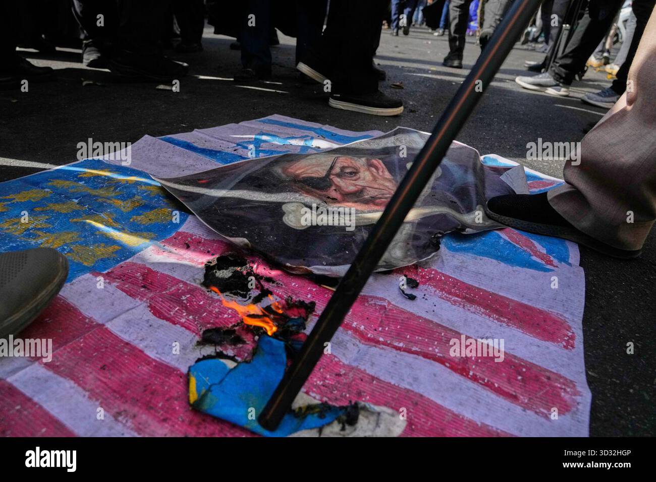 A representation of the U.S. and Israeli flags and a satirized portrait ...