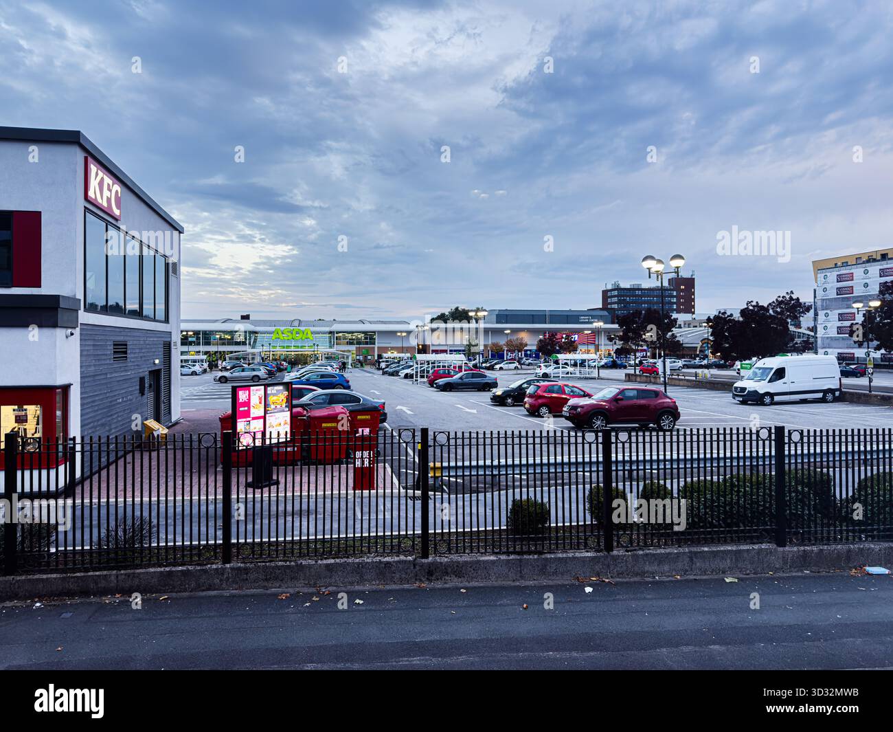 Manchester, UK - September 29, 2025: Busy UK parking lot beside KFC and ...