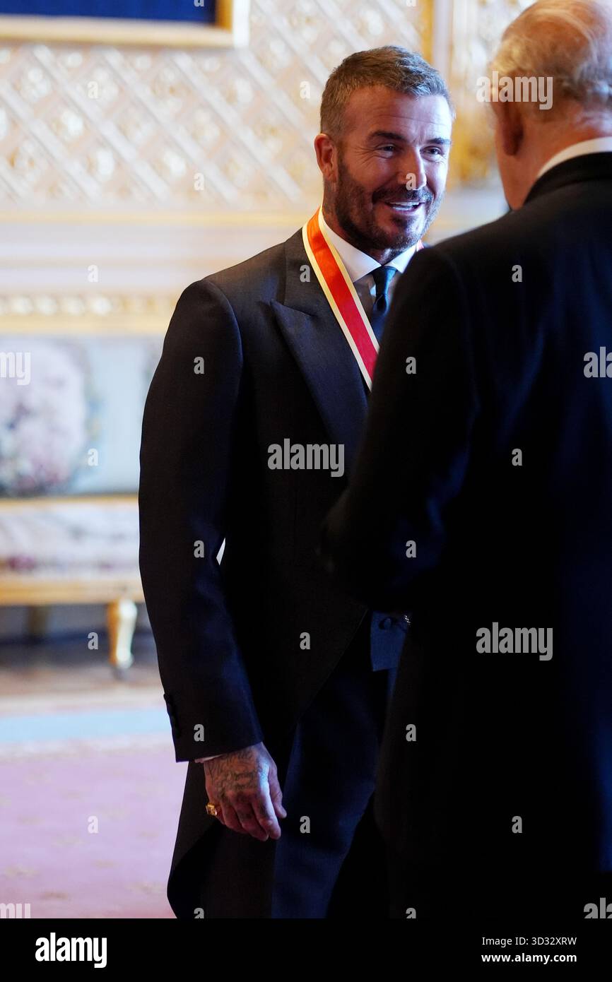 Sir David Beckham is made a Knight Bachelor by King Charles III during ...