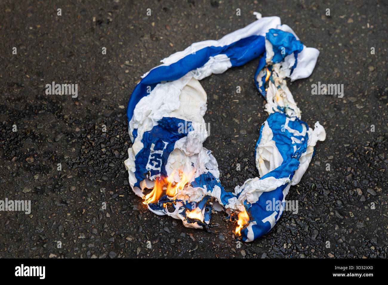 Protesters burn Israeli flag during a rally marking the 46th ...